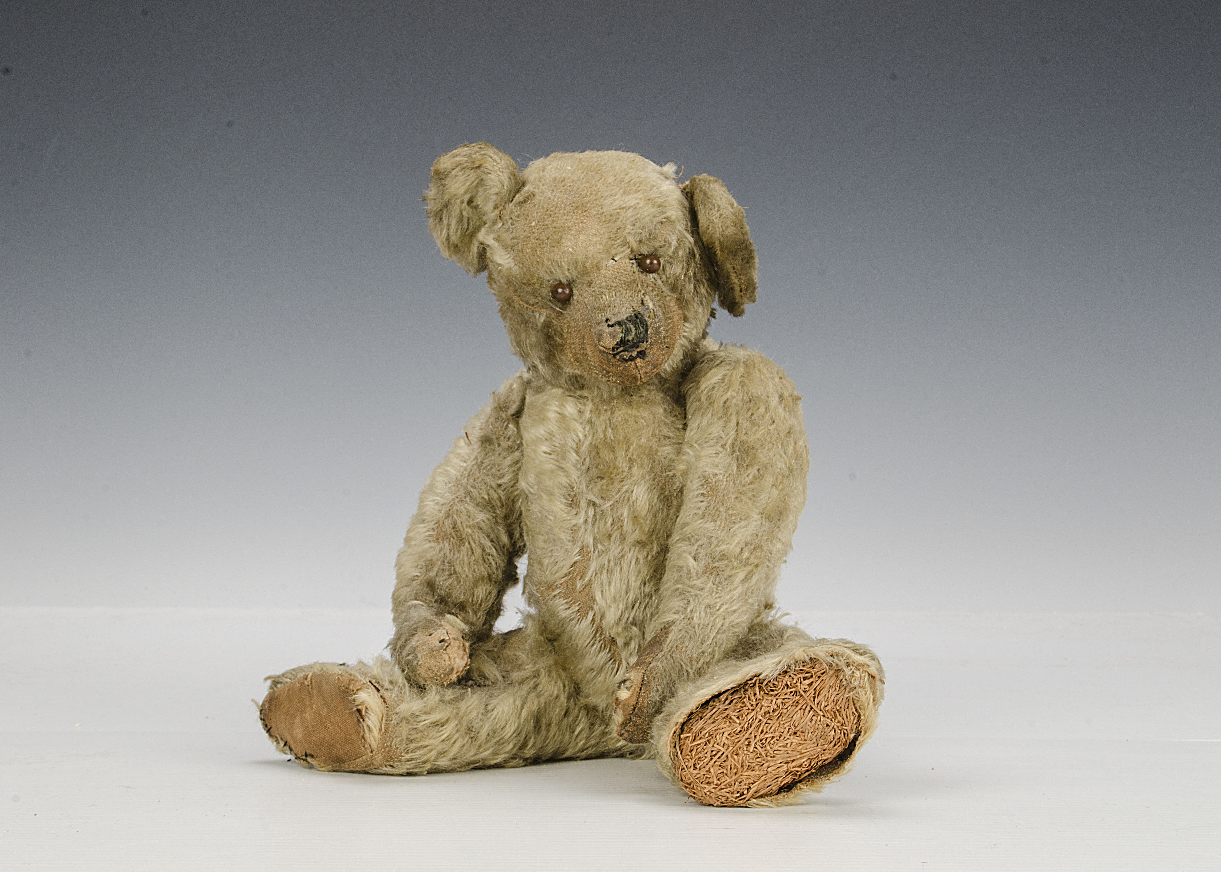 A J.K. Farnell teddy bear, circa 1920, with blond mohair, pronounced ...