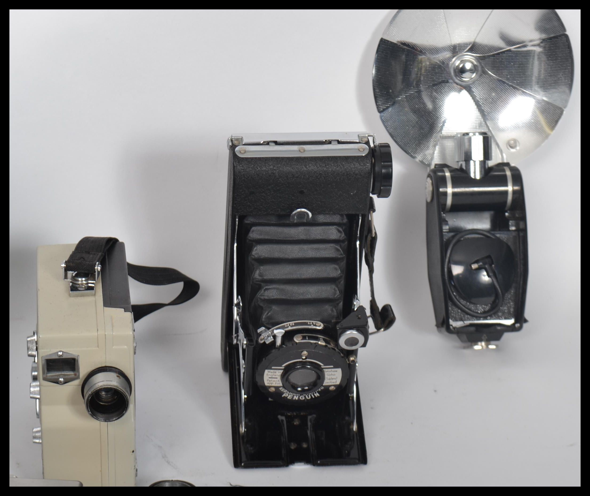 A good collection of vintage and retro 20th century cameras to include ...