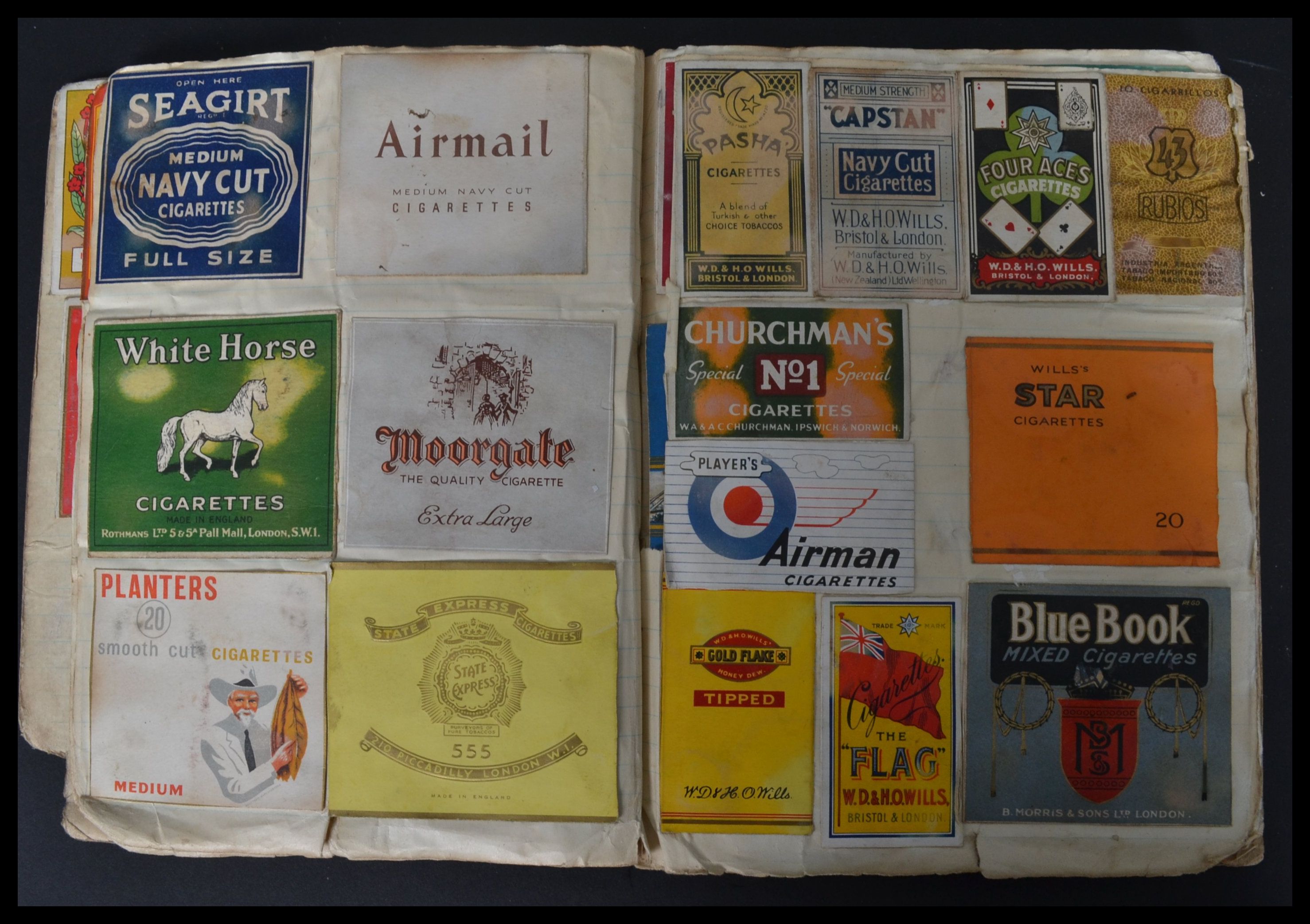 A collection of early 20th century cigarette packets contained within ...