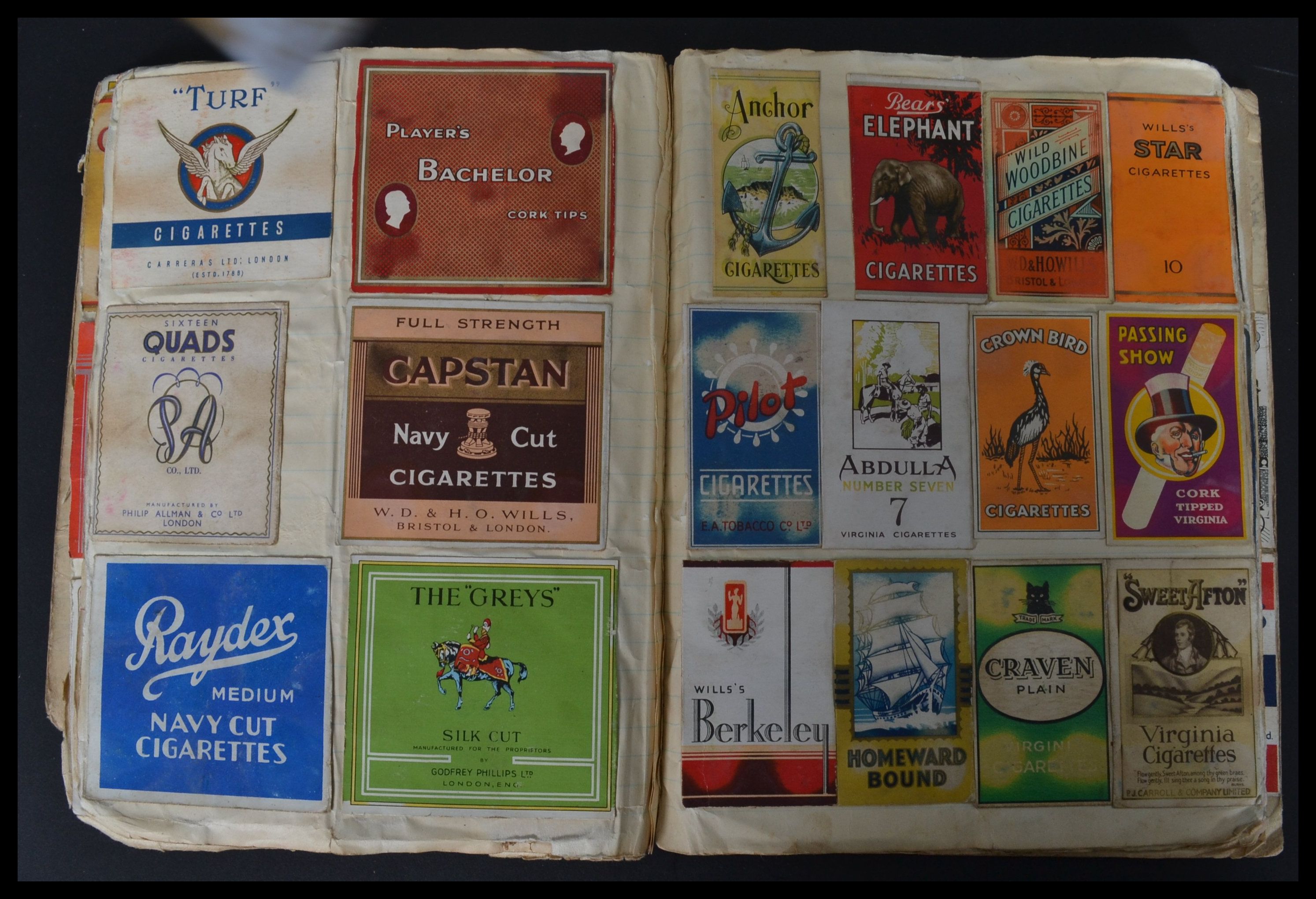 A collection of early 20th century cigarette packets contained within ...