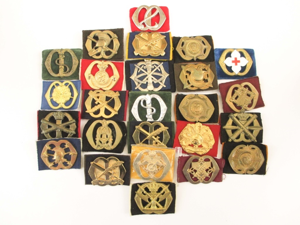 NETHERLANDS - 25 DUTCH ARMY BADGES Dutch army cap devices. (25)