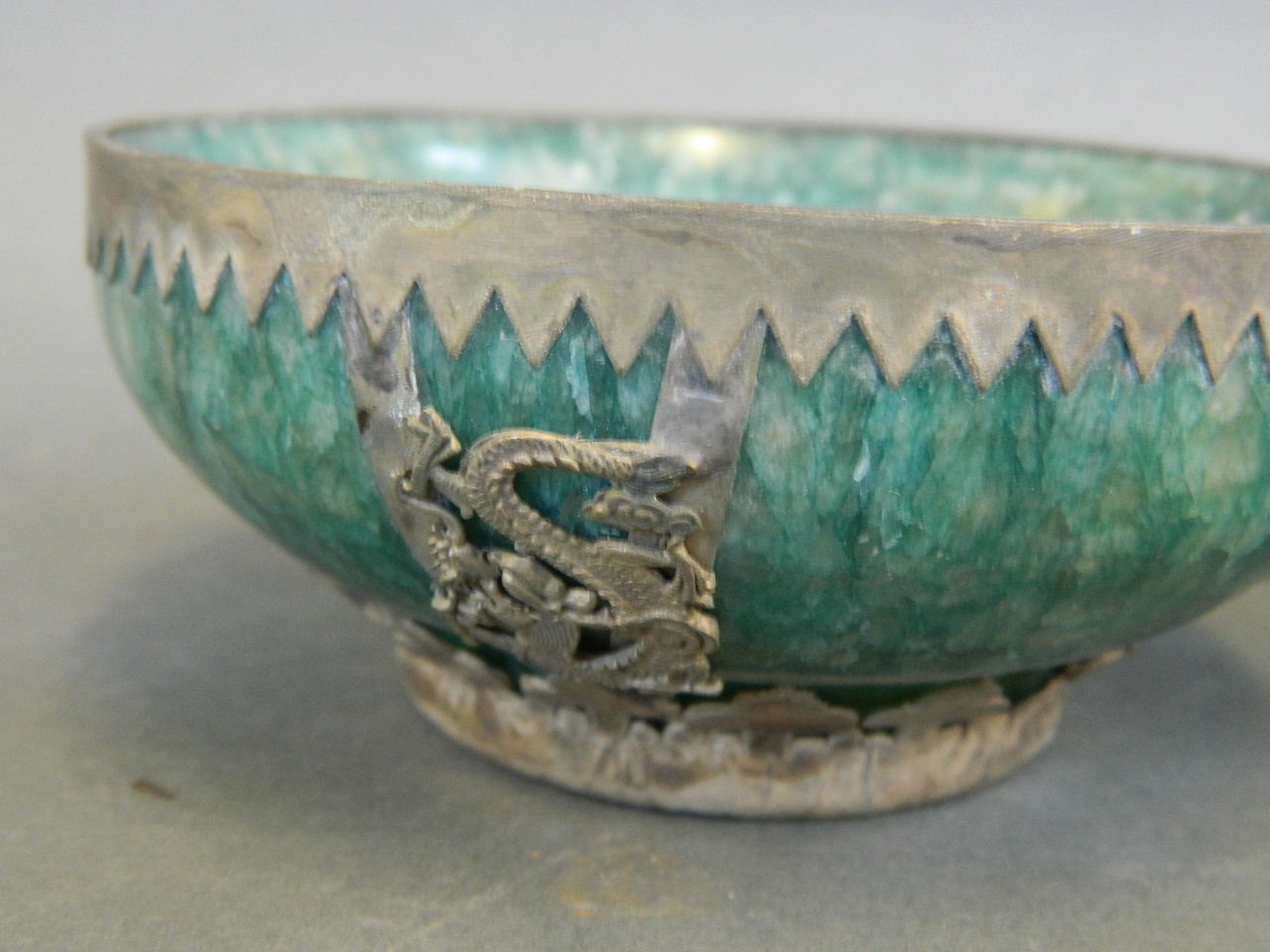 A pair of Chinese green jade rice bowls with white metal dragon and ...