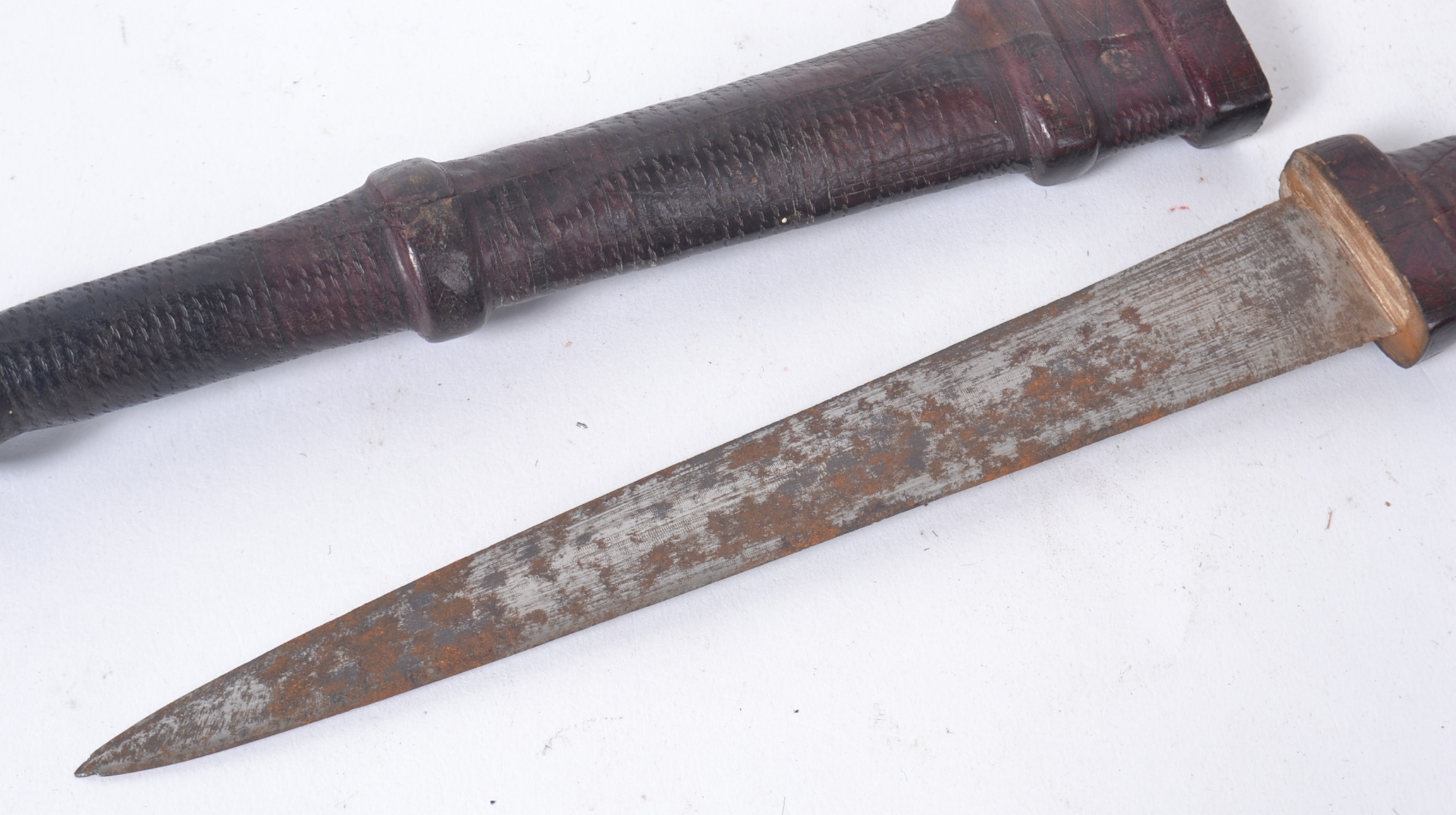 A vintage Indian ceremonial dagger knife, with a carved handle