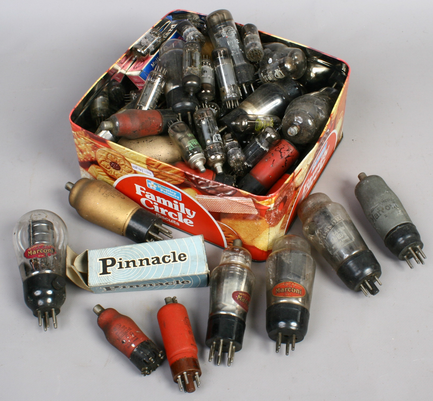 A tin of old retro radio valves