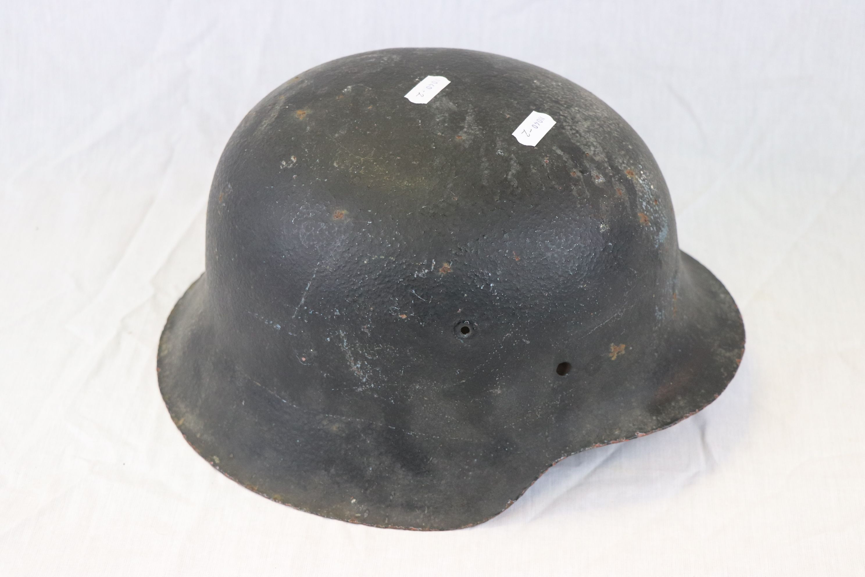 A World War Two / WW2 German Helmet, Over Painted And In Relic Condition.
