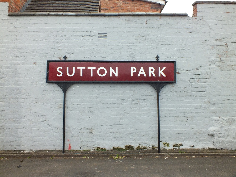 A GENUINE SUTTON PARK ENAMELLED RAILWAY PLATFORM SIGN, with later ...