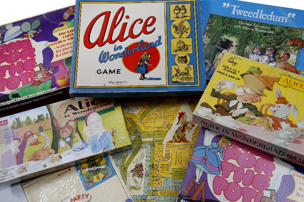 A 1930'S ALICE IN WONDERLAND PRINTED FOLDING GAME BOARD; a Cadaco Alice ...