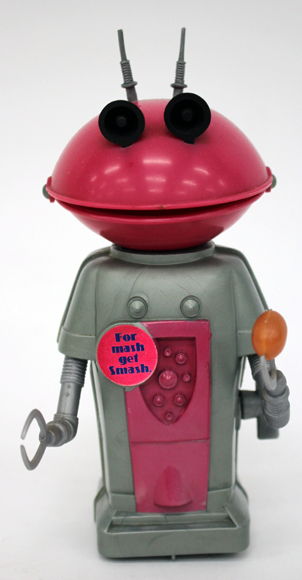A PLASTIC CLOCKWORK 'FOR MASH GET SMASH' ROBOT TOY approximately 15cm tall