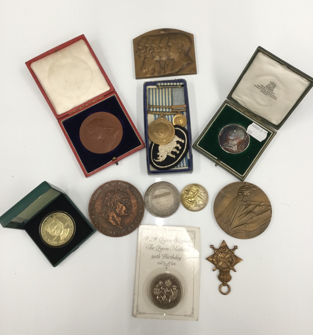 A collection of medals, medallions and coins
