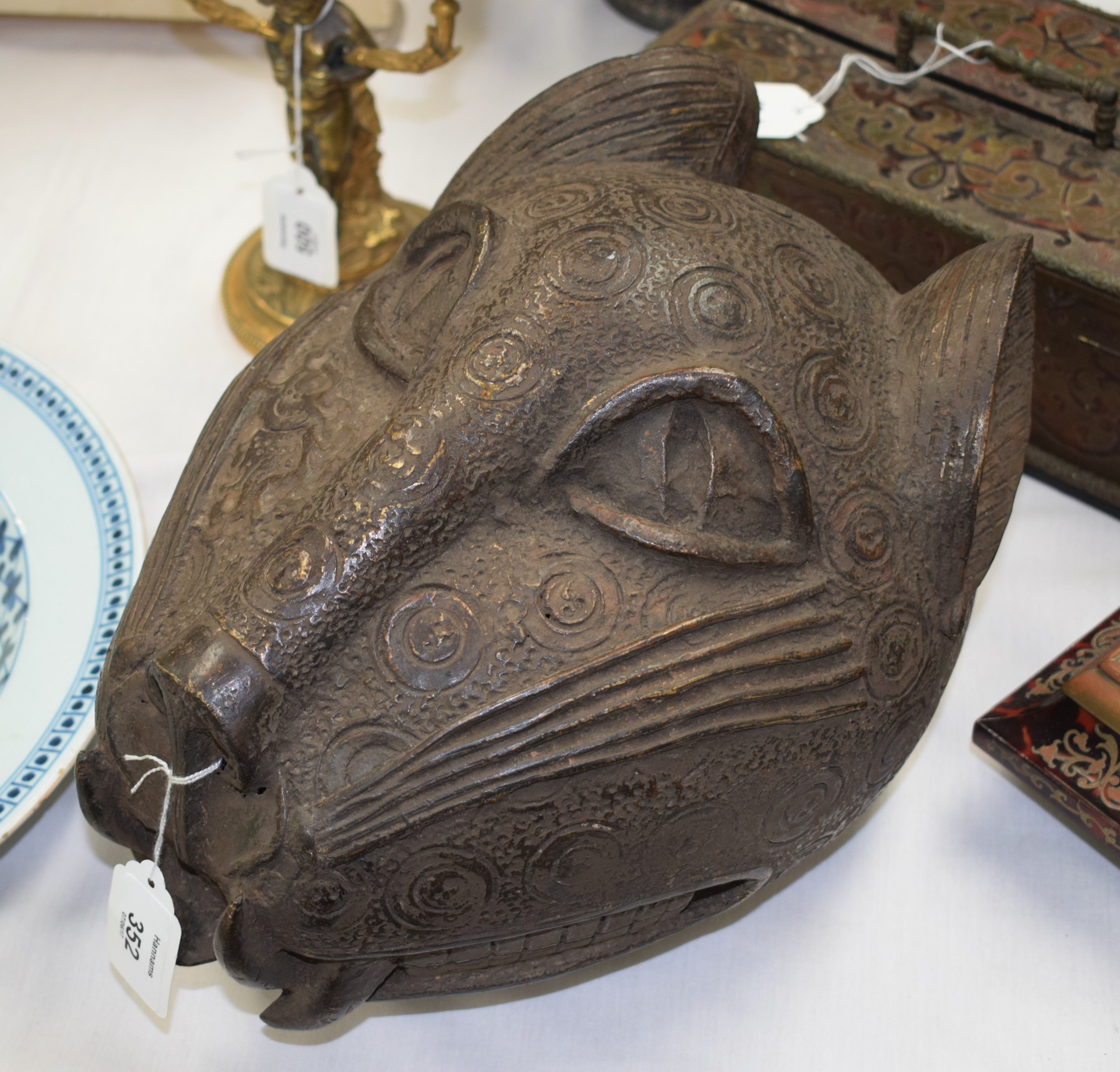 A GOOD ANTIQUE AFRICAN BENIN BRONZE MASK modelled in the form of a ...