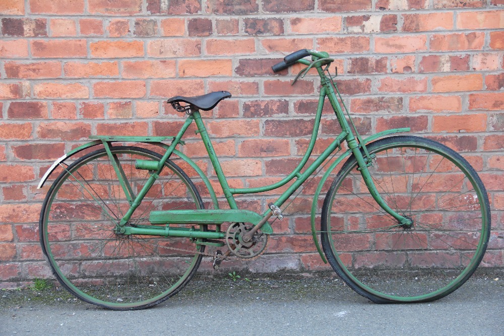 A vintage Hercules Lady's loop frame bicycle, with later green painted ...