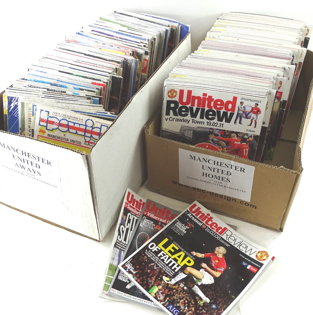 Various boxes of Manchester United football programmes, home and away ...
