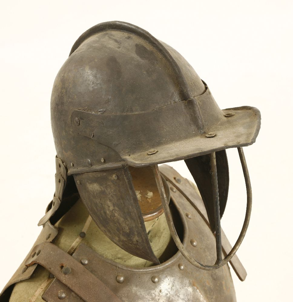Cromwellian armour,a lobster tail helmet, with hinged face guard ...