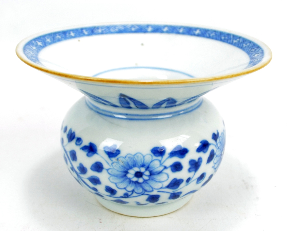 A Chinese porcelain spittoon painted in underglaze blue with band of ...