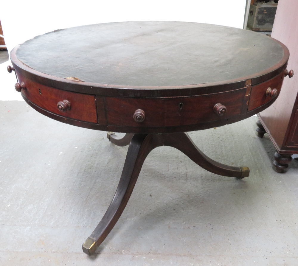 An early 19th century mahogany circular library table with leatherette ...