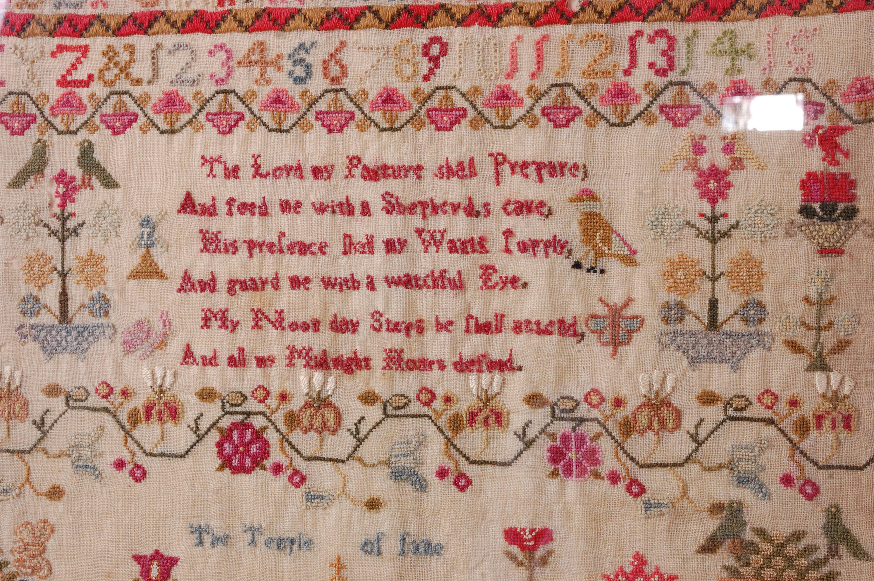 A George IV needlework, alphabet, number, verse and picture sampler, by ...