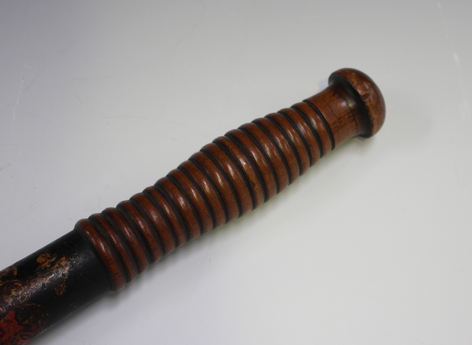 A Victorian turned wooden police truncheon, painted with a Royal coat ...