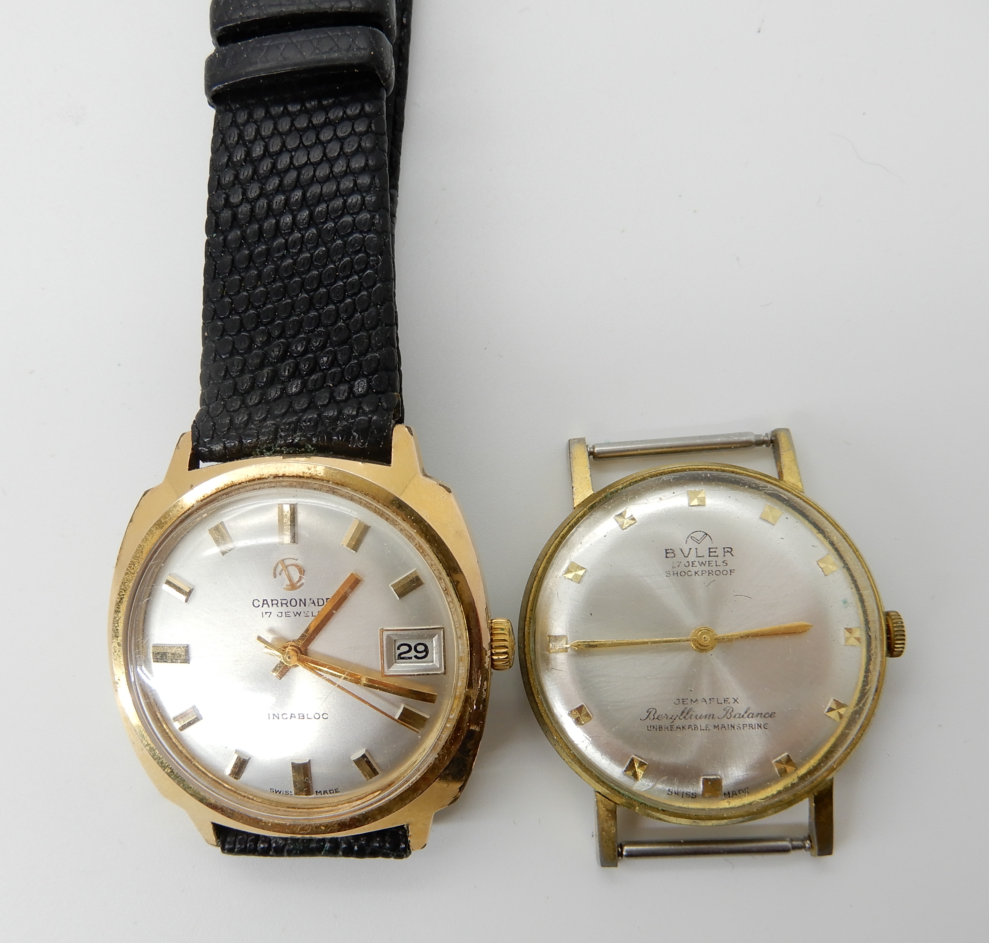 A gold plated vintage Buler watch head, together with a gold plated ...