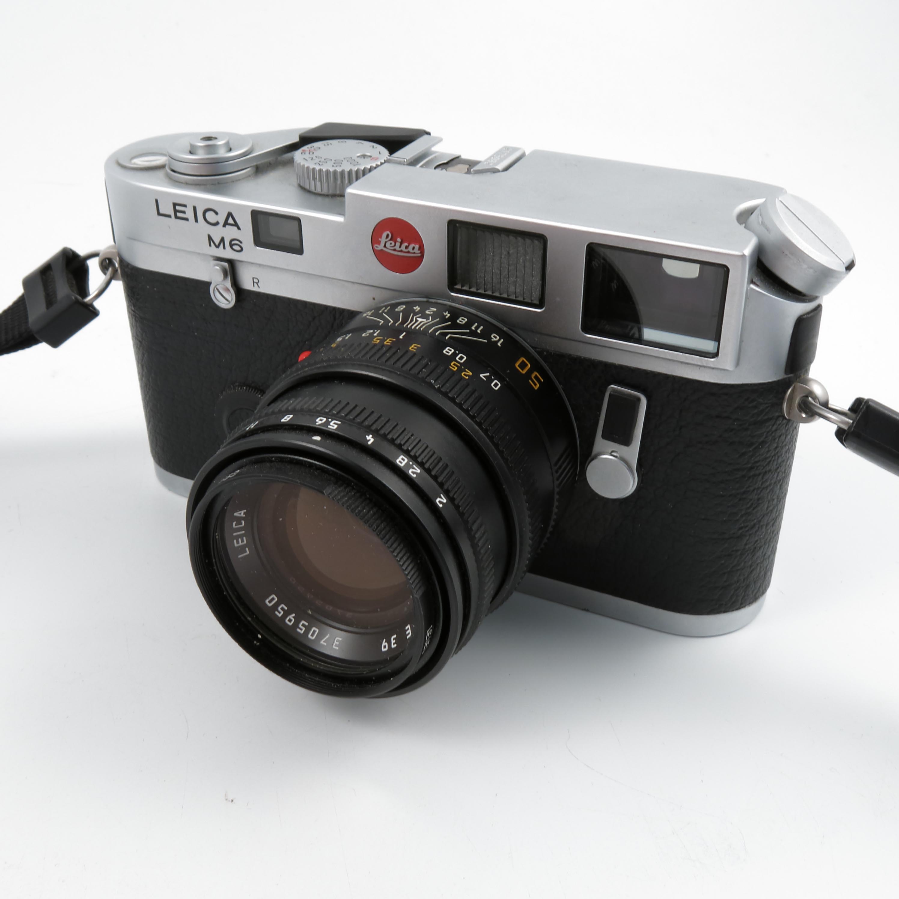 A Leica M6 camera, in chrome, numbered 2175082, with lens