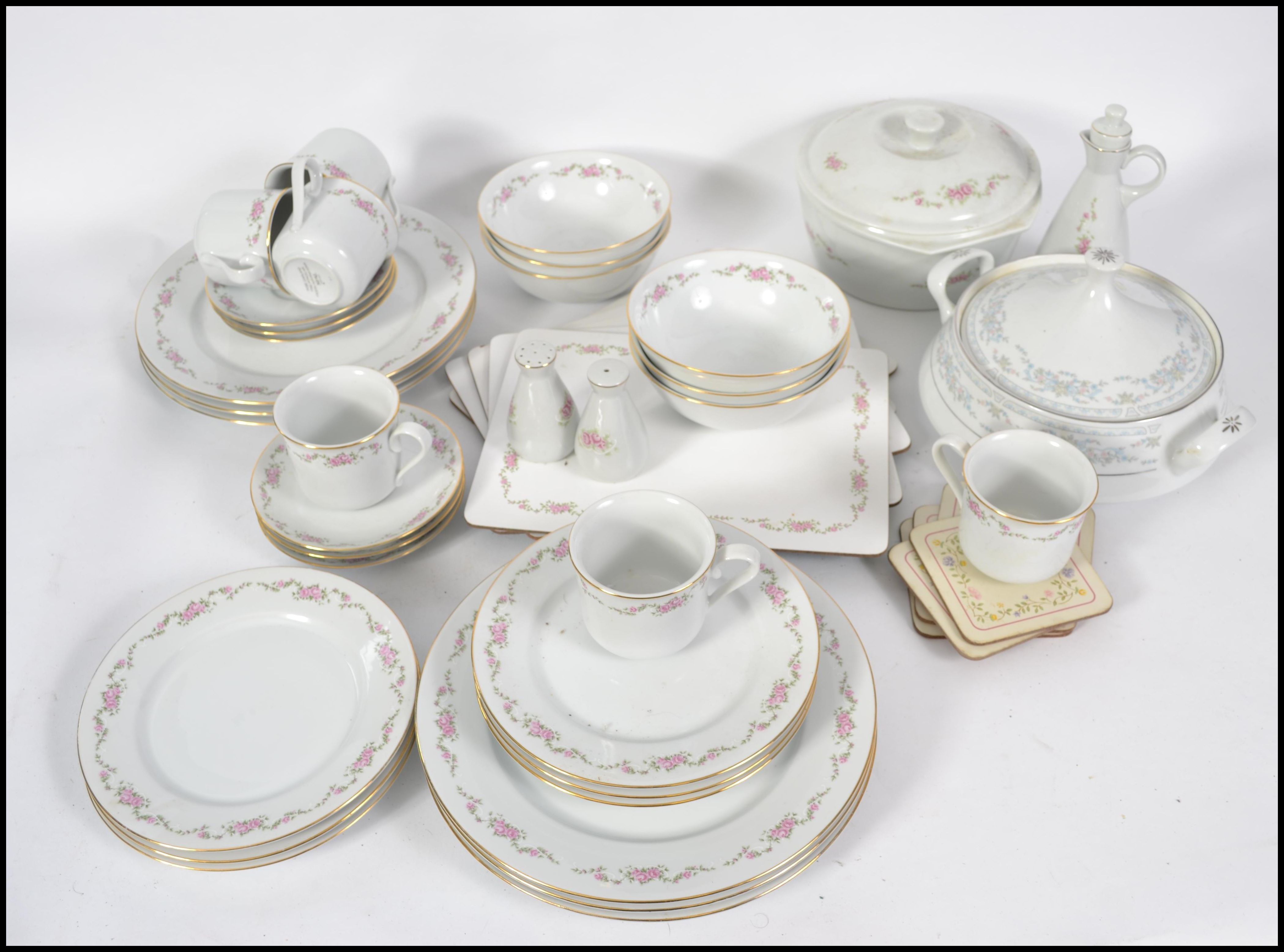 A large chintzy pattern Bone China extensive floral tea and dinner ...