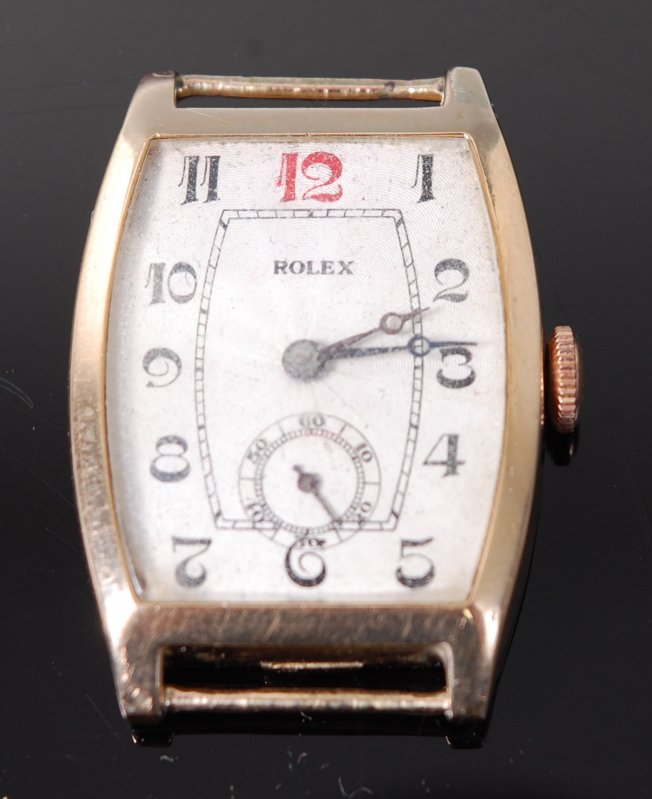 A vintage gents 9ct gold Rolex tank watch, having a signed silvered ...