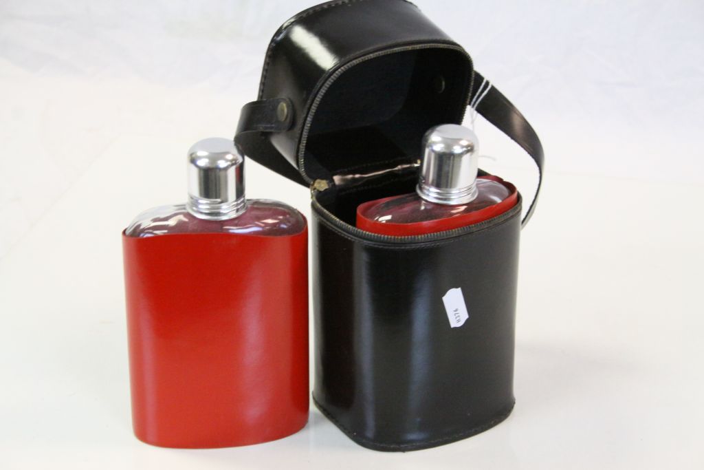 Leather cased pair of Chrome topped Glass Hip Flasks with carry strap ...