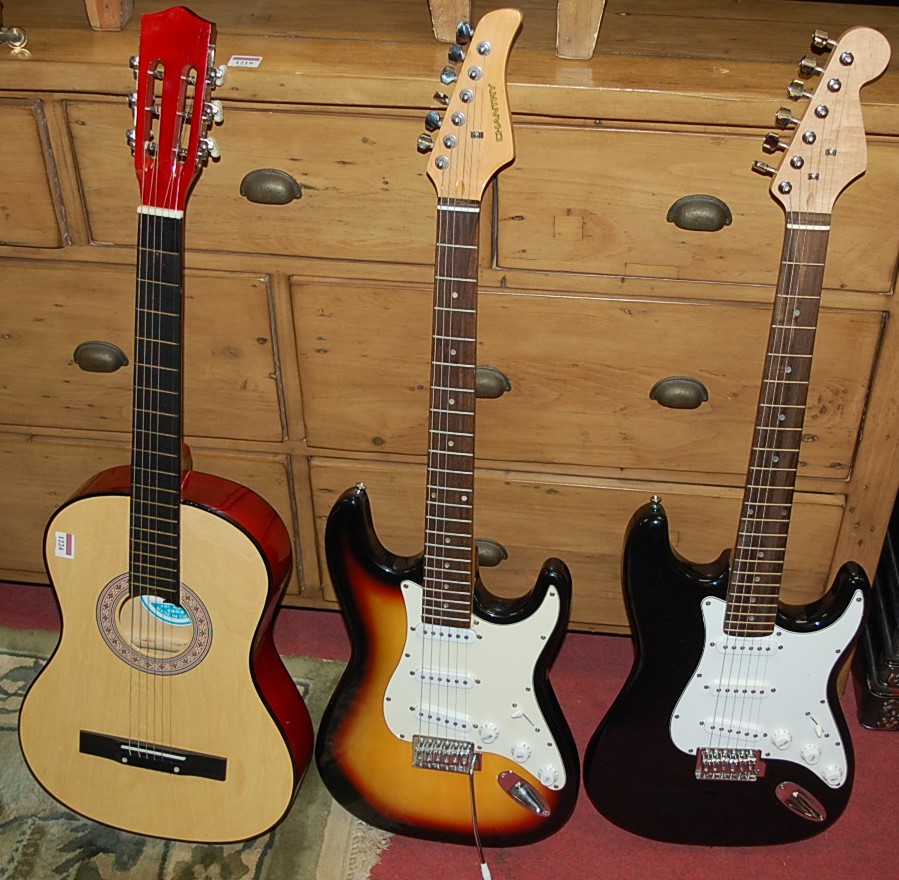 Two contemporary electric guitars; together with one other (3)