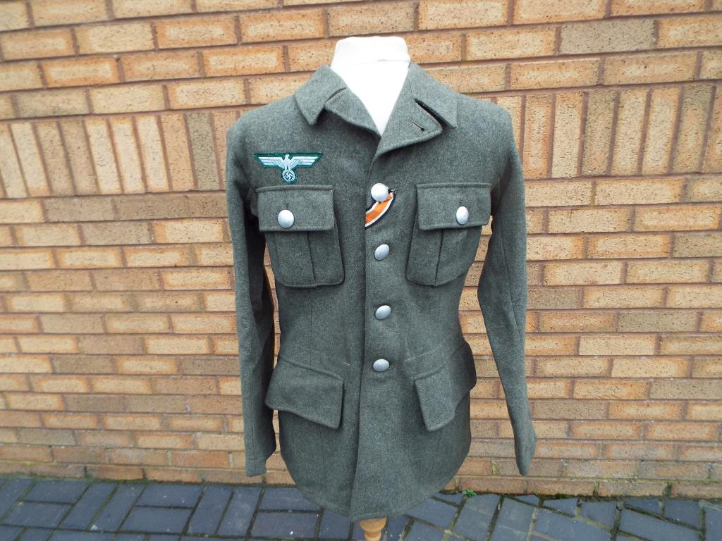 Uniform - a German WWII M44 enlisted soldiers woolen field tunic, four ...