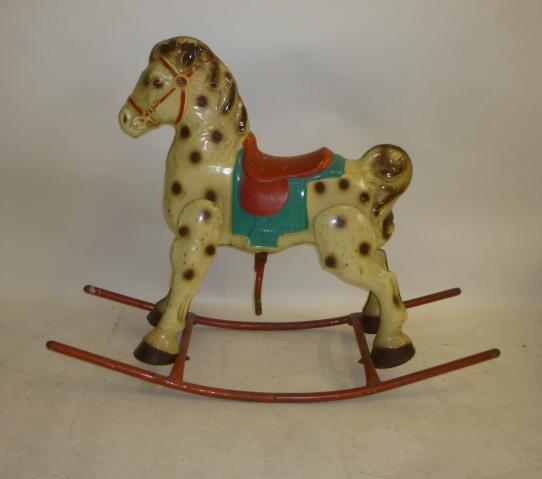 A Mobo rocking horse, c.1960, painted tinplate on tubular metal rocker ...