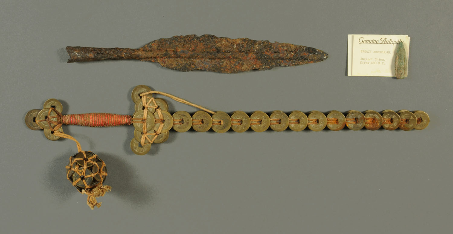 A Chinese cash coin sword, with cash coin to tassel, a bronze spearhead ...