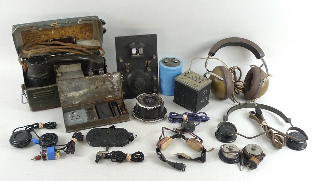 A collection of mostly military communications equipment, including a ...
