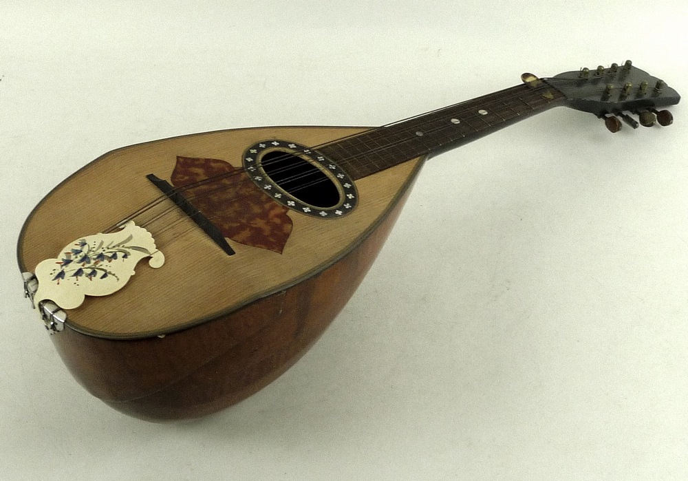 An eight string mandolin, early 20th century, with mother of pearl ...
