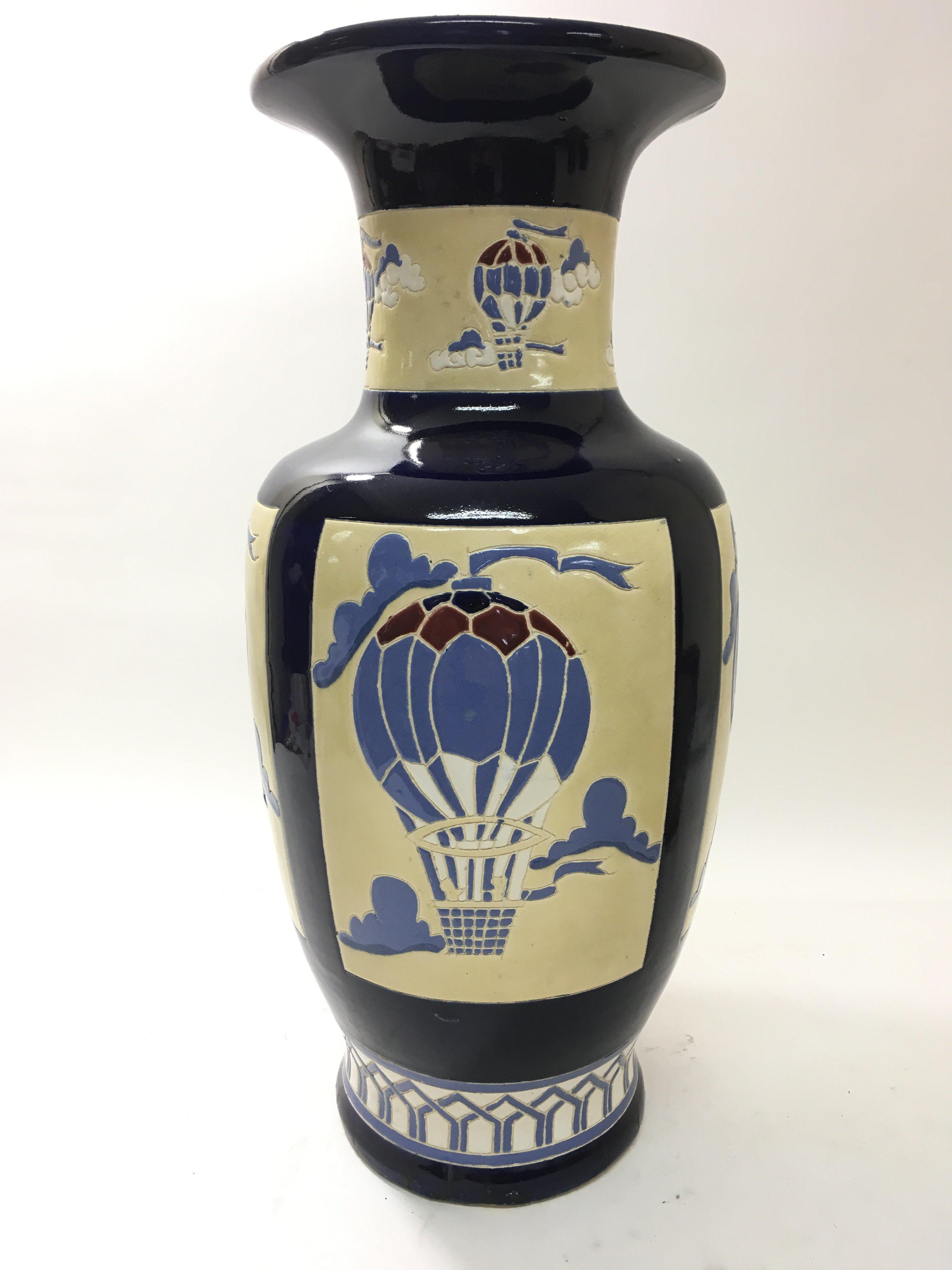 A large Brannam balloon vase, decorated with hot air balloons with ...