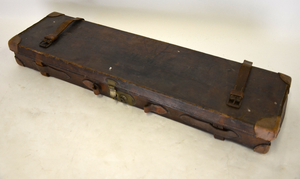 An antique leather gun case, trade label to interior for W W Greener ...