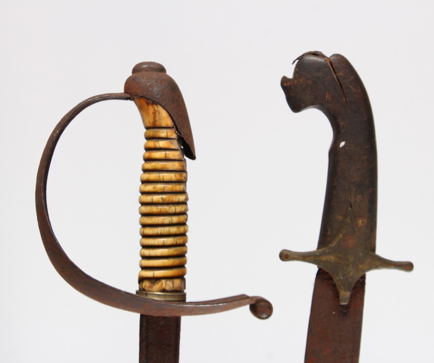 A RELIC CAVALRY SWORD, curved blade, plain iron hilt with ivory grip ...