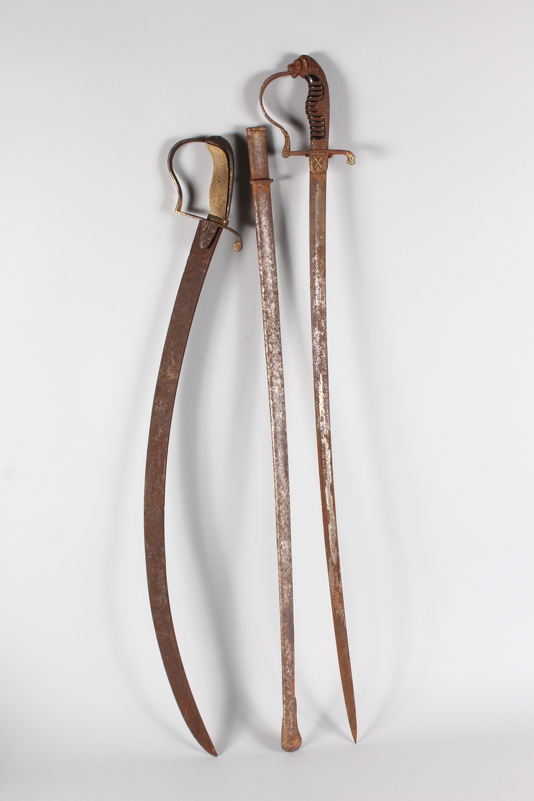 A CAVALRY OFFICERS SWORD, plain curved blade, stirrup hilt with traces ...