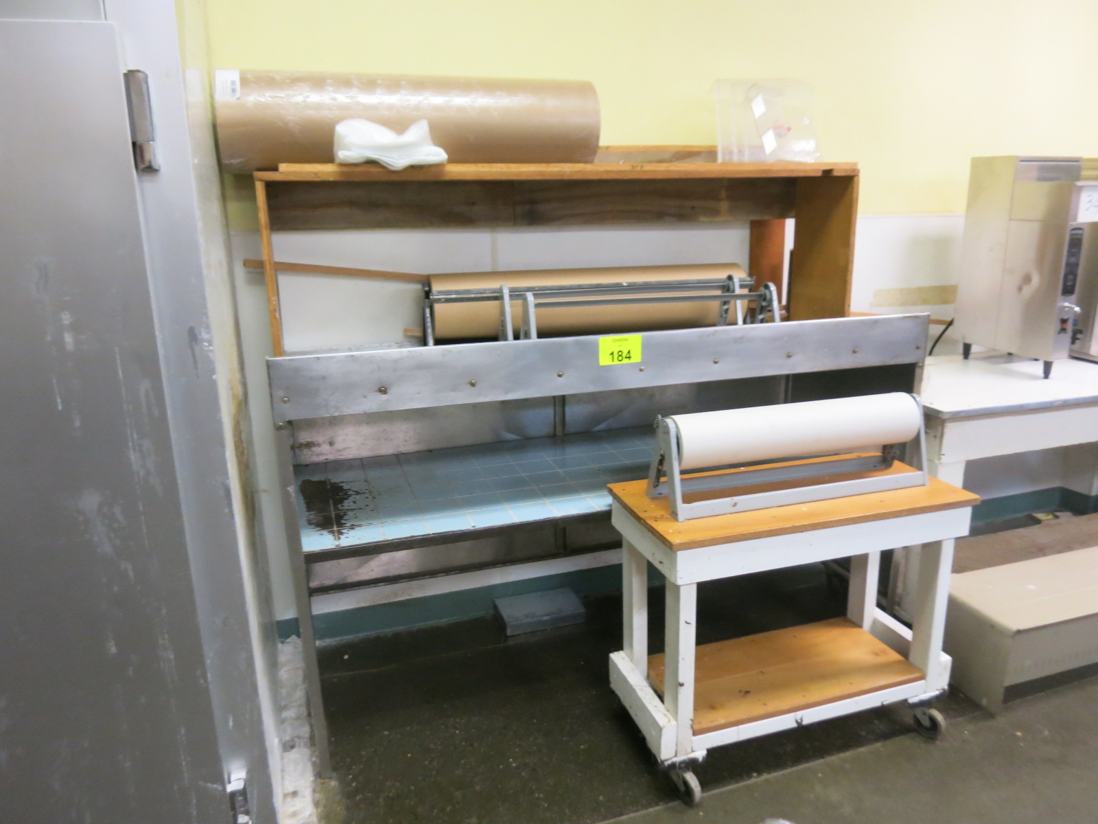 Wrapping table, 65" x 24" x 40" with (4) paper roll cutters