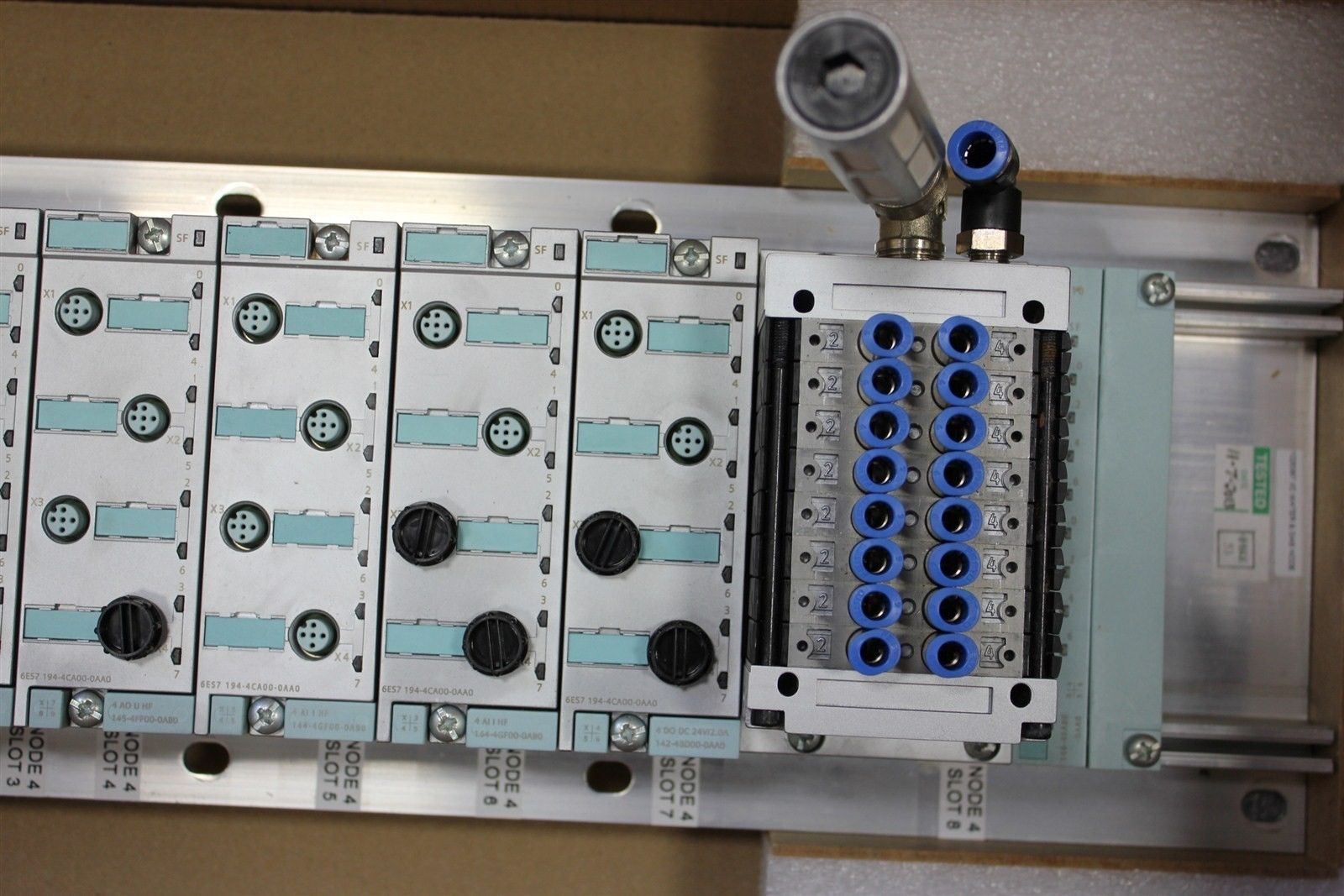 New Siemens simatic Et200 pro PLC i/o rack with modules. Unit has the ...