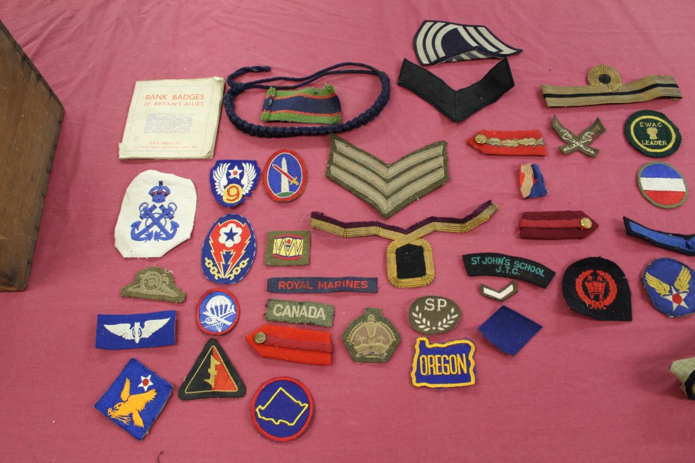 Large collection of cloth military badges - including R.A.A.F., S.A.S ...