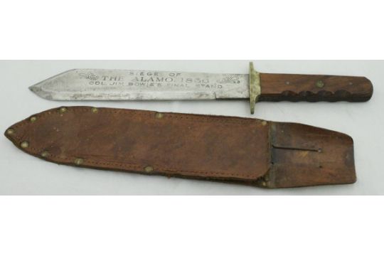 A modern Bowie knife, the blade inscribed "Siege of the Alamo 1836 Col ...