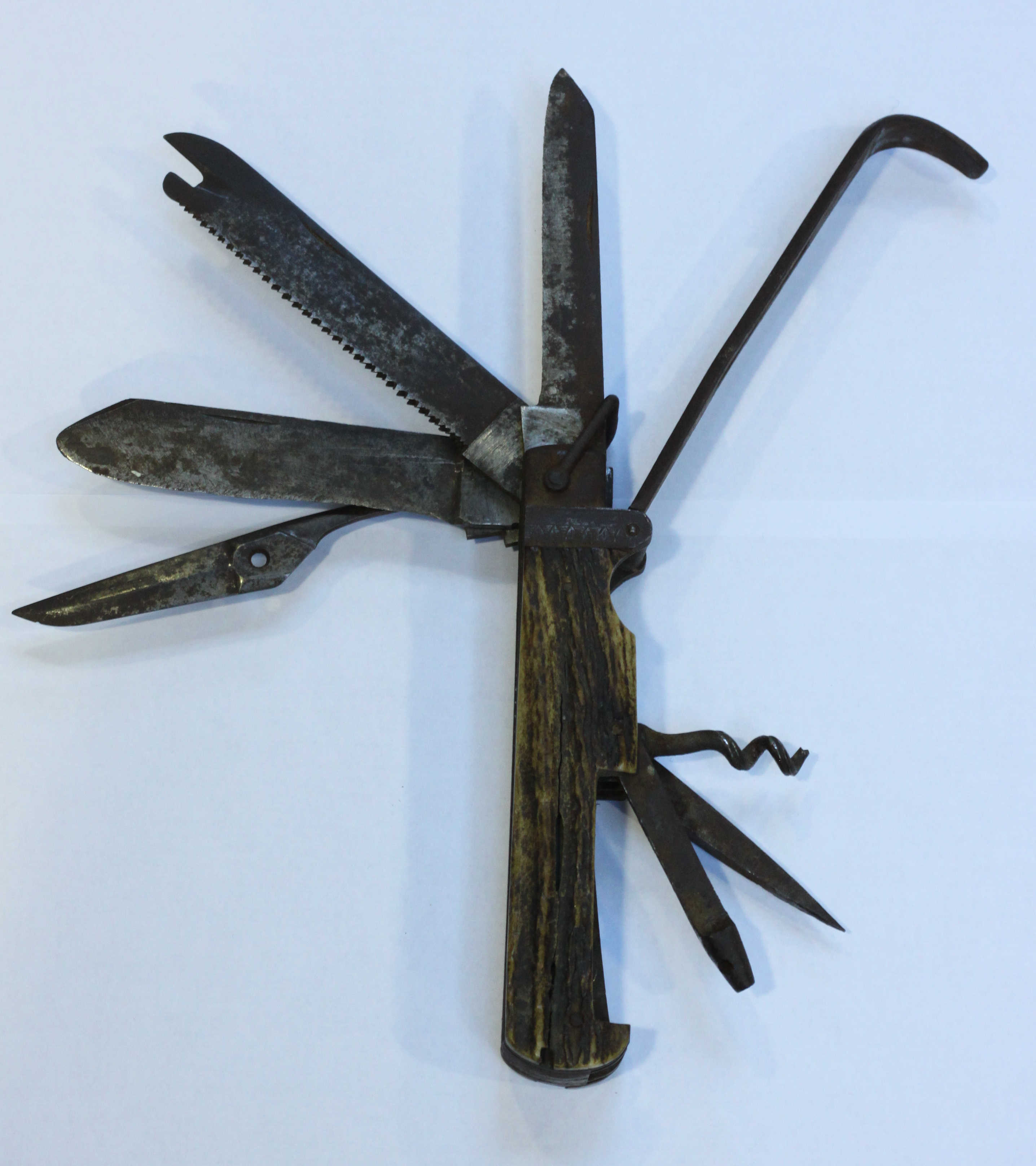 A 19th century coachman's folding pocket knife with eight implements ...