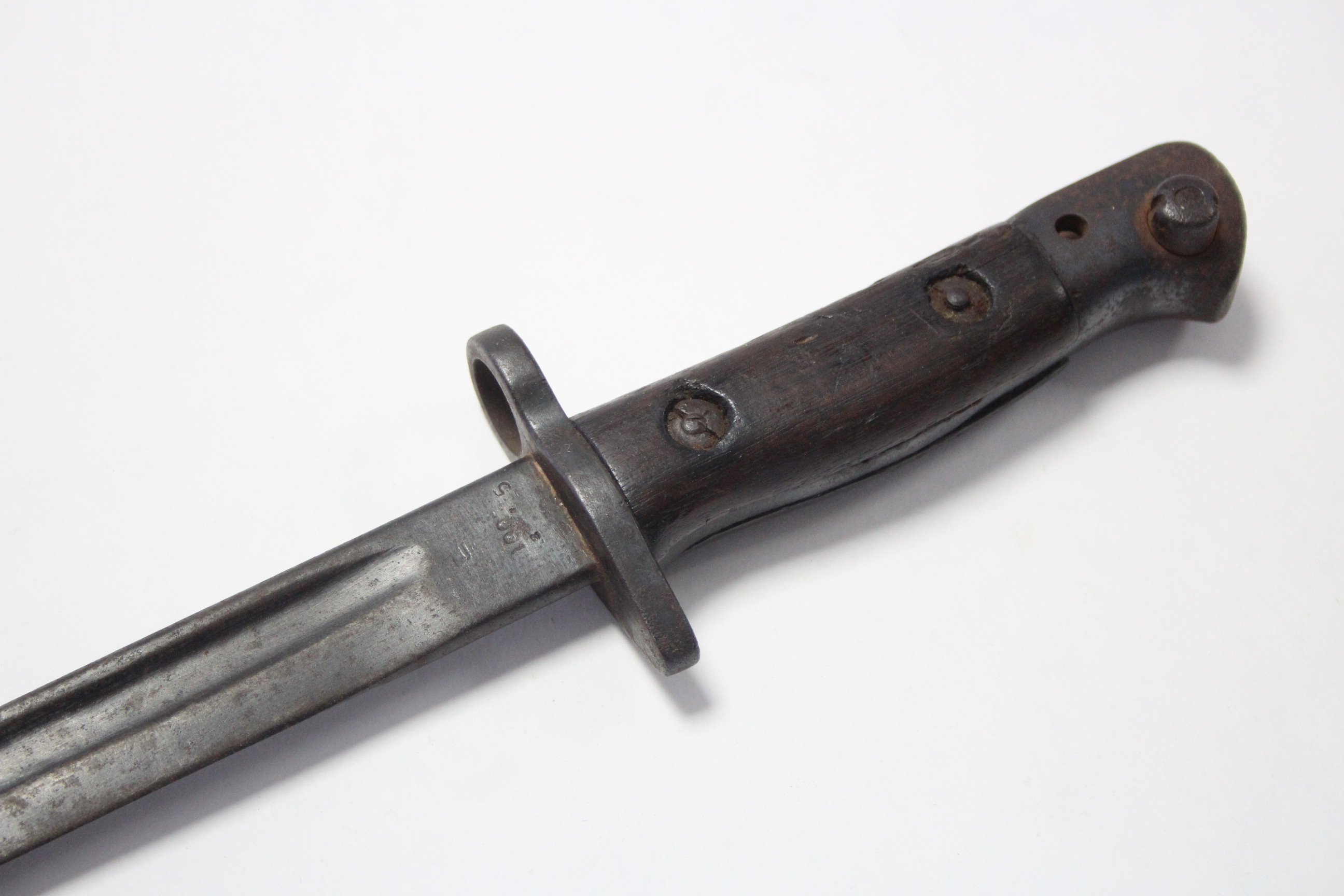 A rifle bayonet with 17” long single-edge curved blade & with hardwood ...