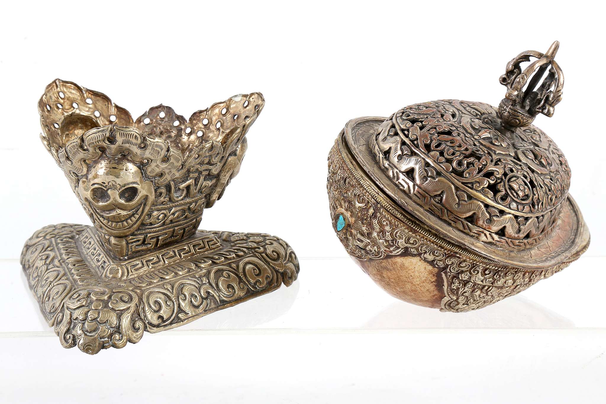 A Tibetan silver coppered repousse Kapala stand and cover ...