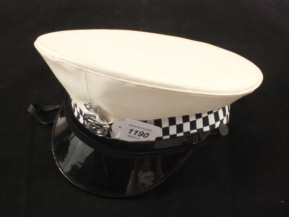 A North Yorkshire traffic Police cap (white top) with a female Police ...