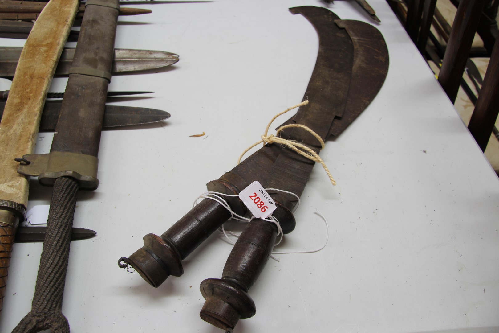 Chinese: a pair of execution swords having carved wooden handles and ...