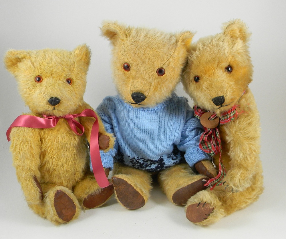 Three Chiltern Teddy bears, 1950s, all with orange glass eyes, two with ...
