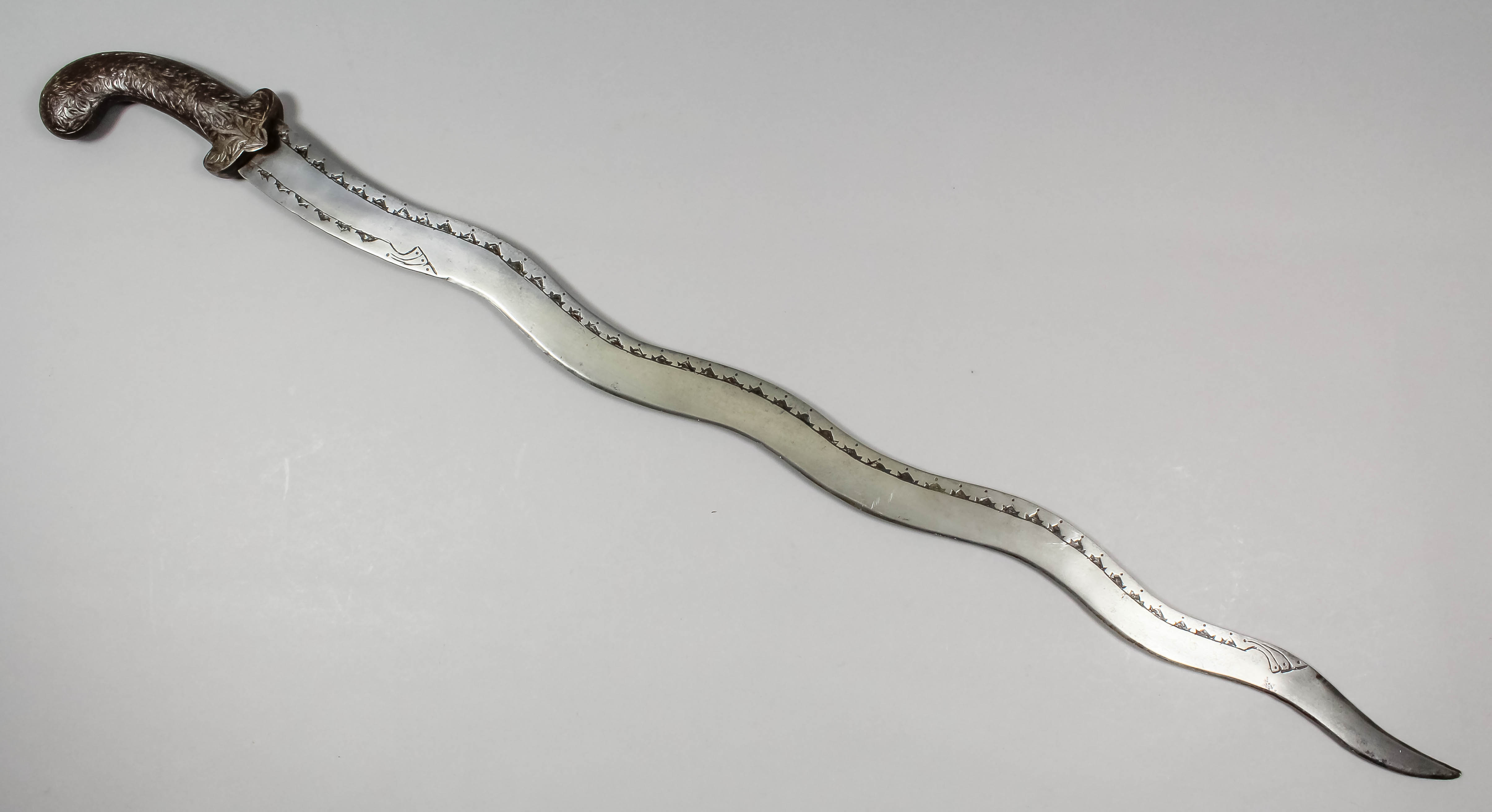 A 19th Century Indian "Nagan" or serpentine sword, the undulating 27ins ...