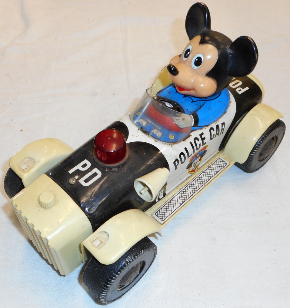 Plastic and tin plate battery operated Mickey Mouse police car, 27cm ...
