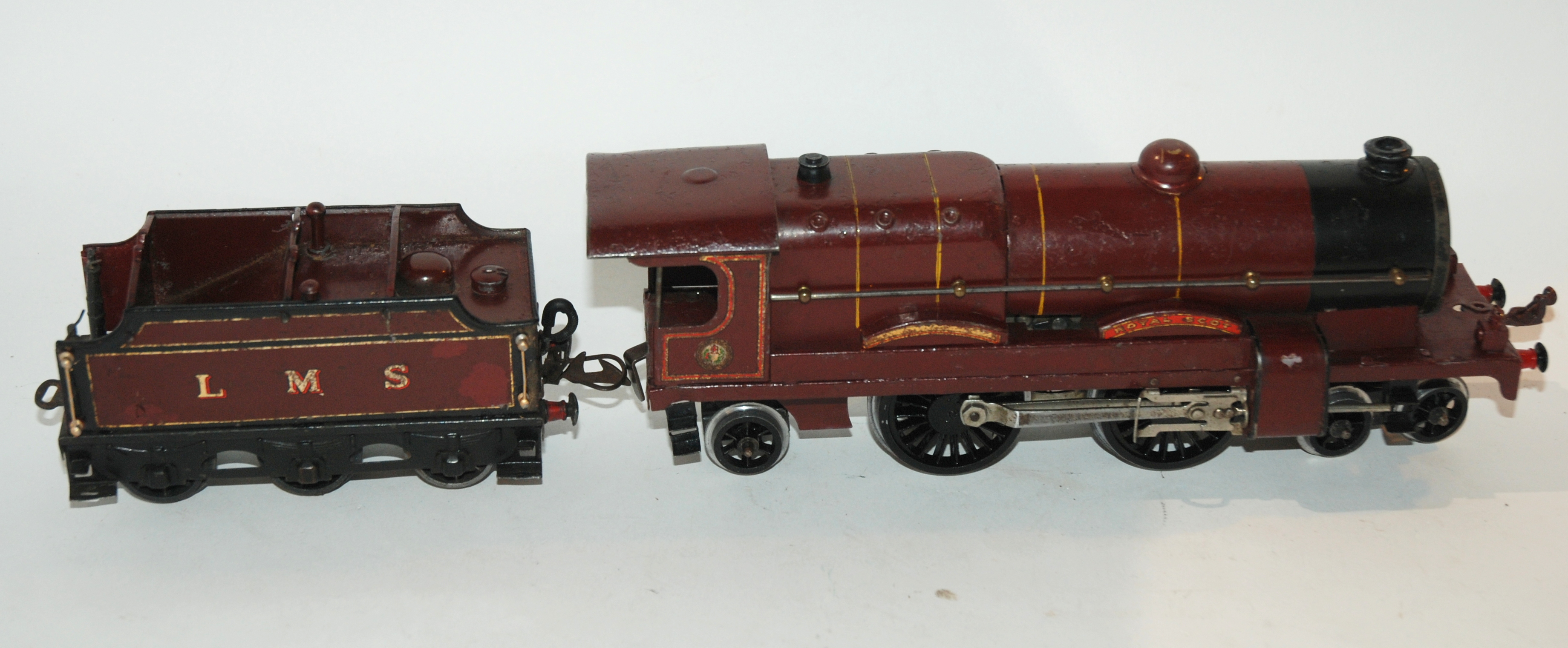 A Hornby Royal Scot clockwork loco and tender and three various wagons ...