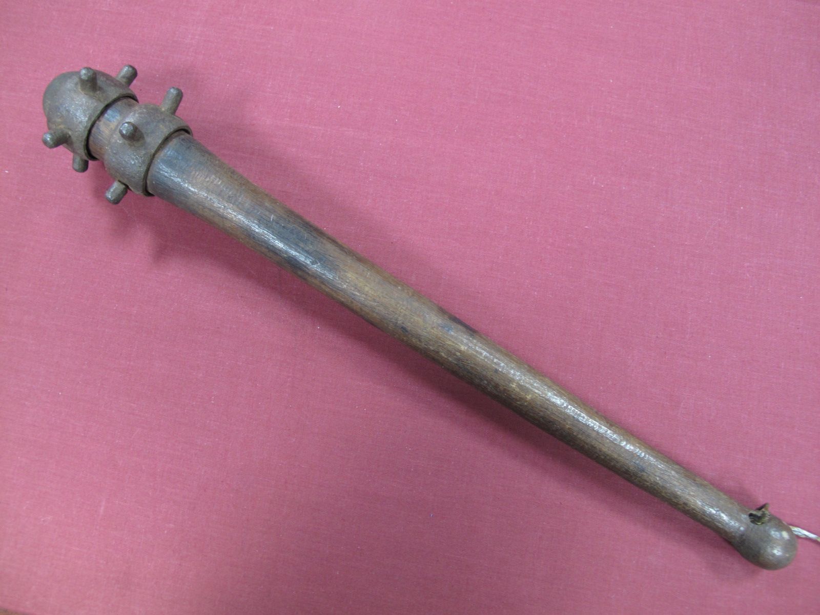 WWI Trench Club, wood handle with two iron studded rings at top.